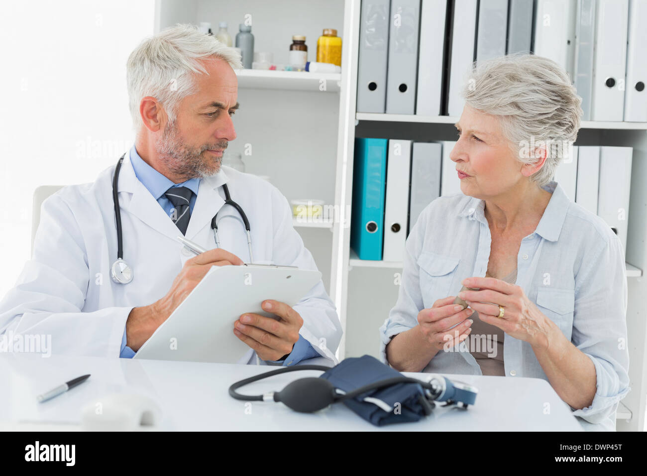 Woman doctor visit 50s hi-res stock photography and images - Alamy
