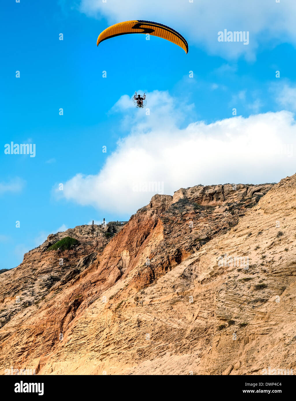 Person paragliding over beach hi-res stock photography and images - Alamy