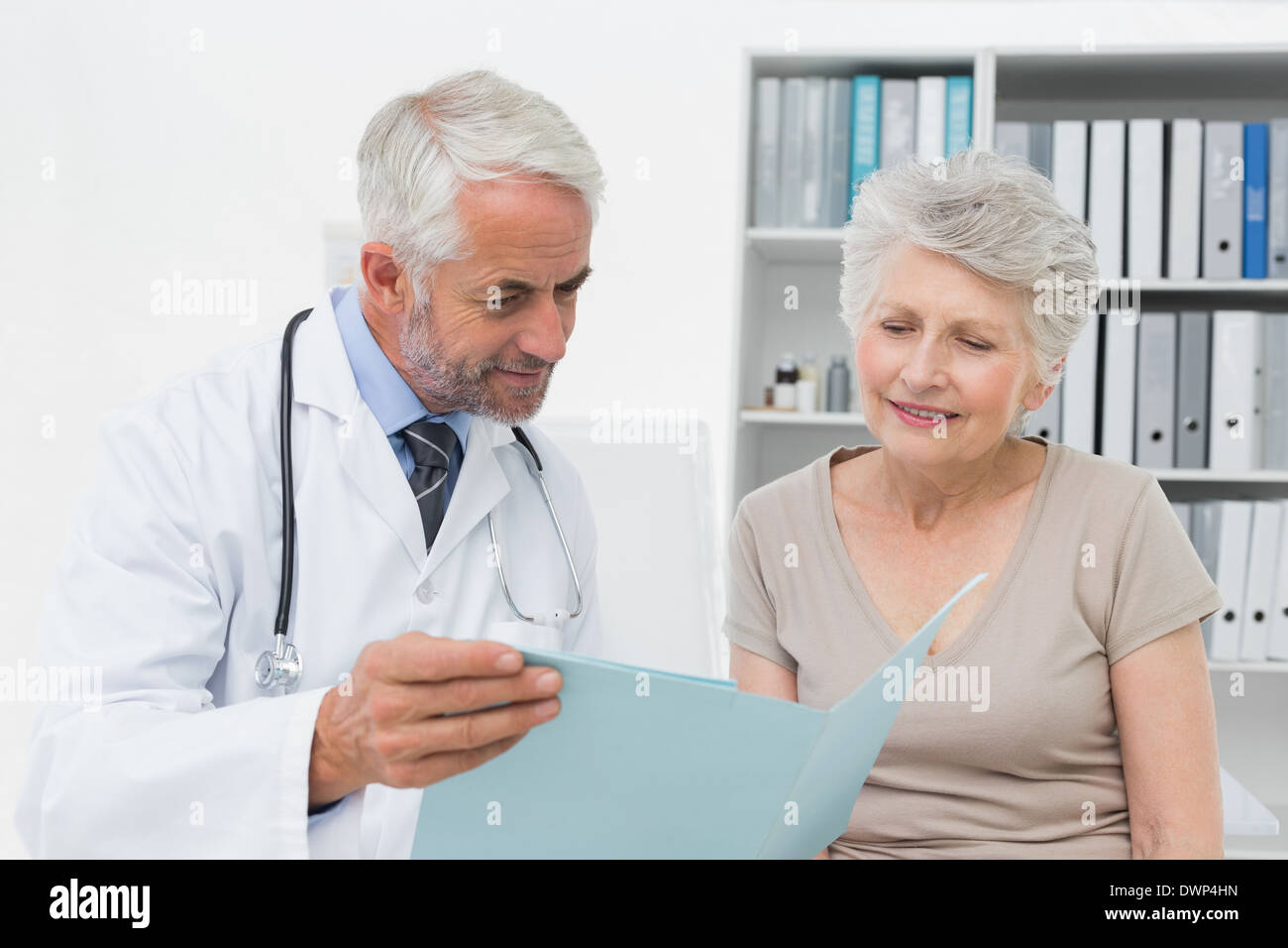 Senior doctor showing reports hi-res stock photography and images - Alamy