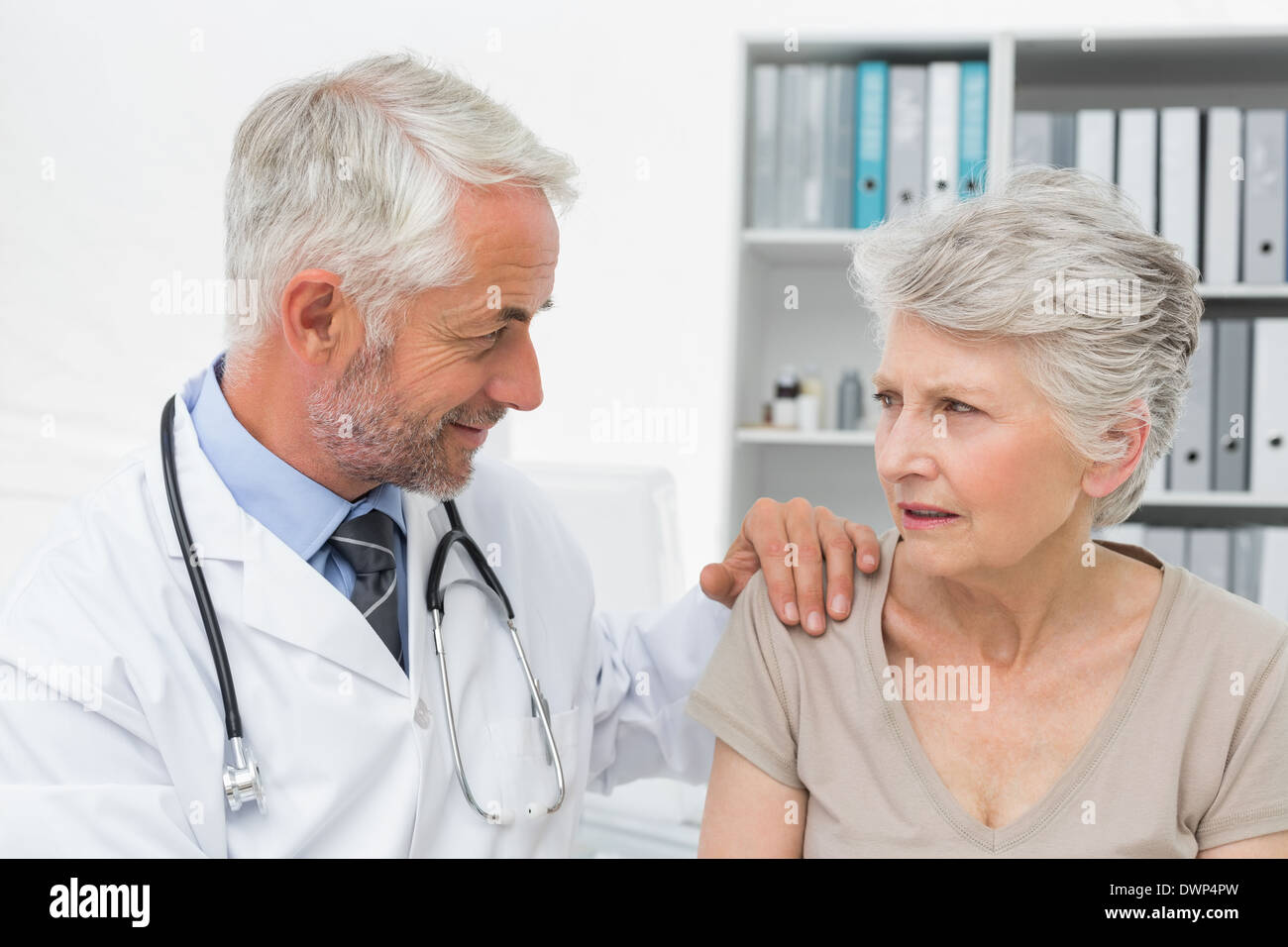 Female senior patient visiting a doctor Stock Photo - Alamy