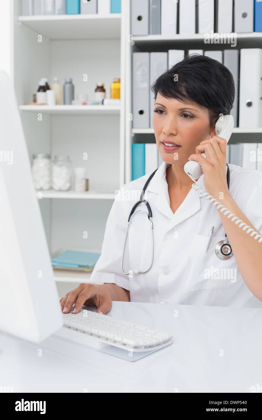 Doctor nurse looking computer monitor hi-res stock photography and ...