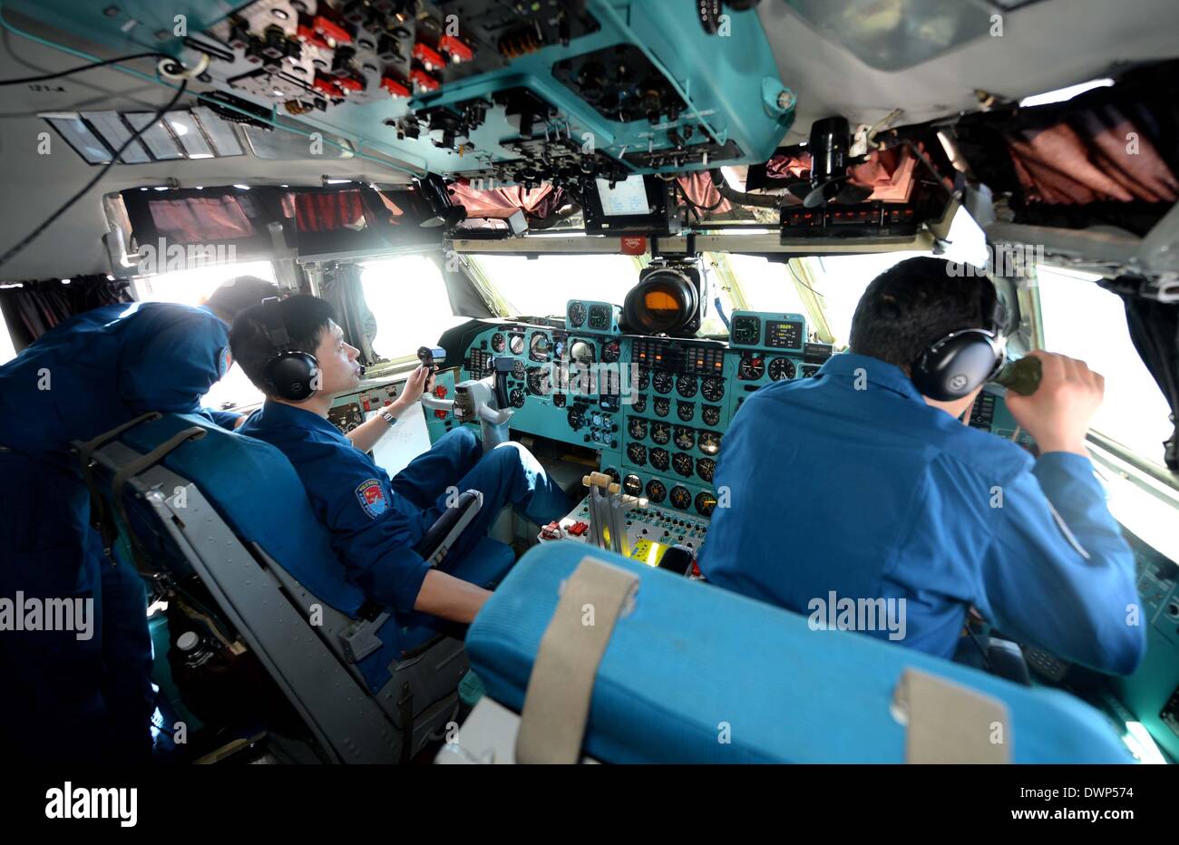 Malaysia, Malaysia. 12th Mar, 2014. Crew members operate on a Chinese ...