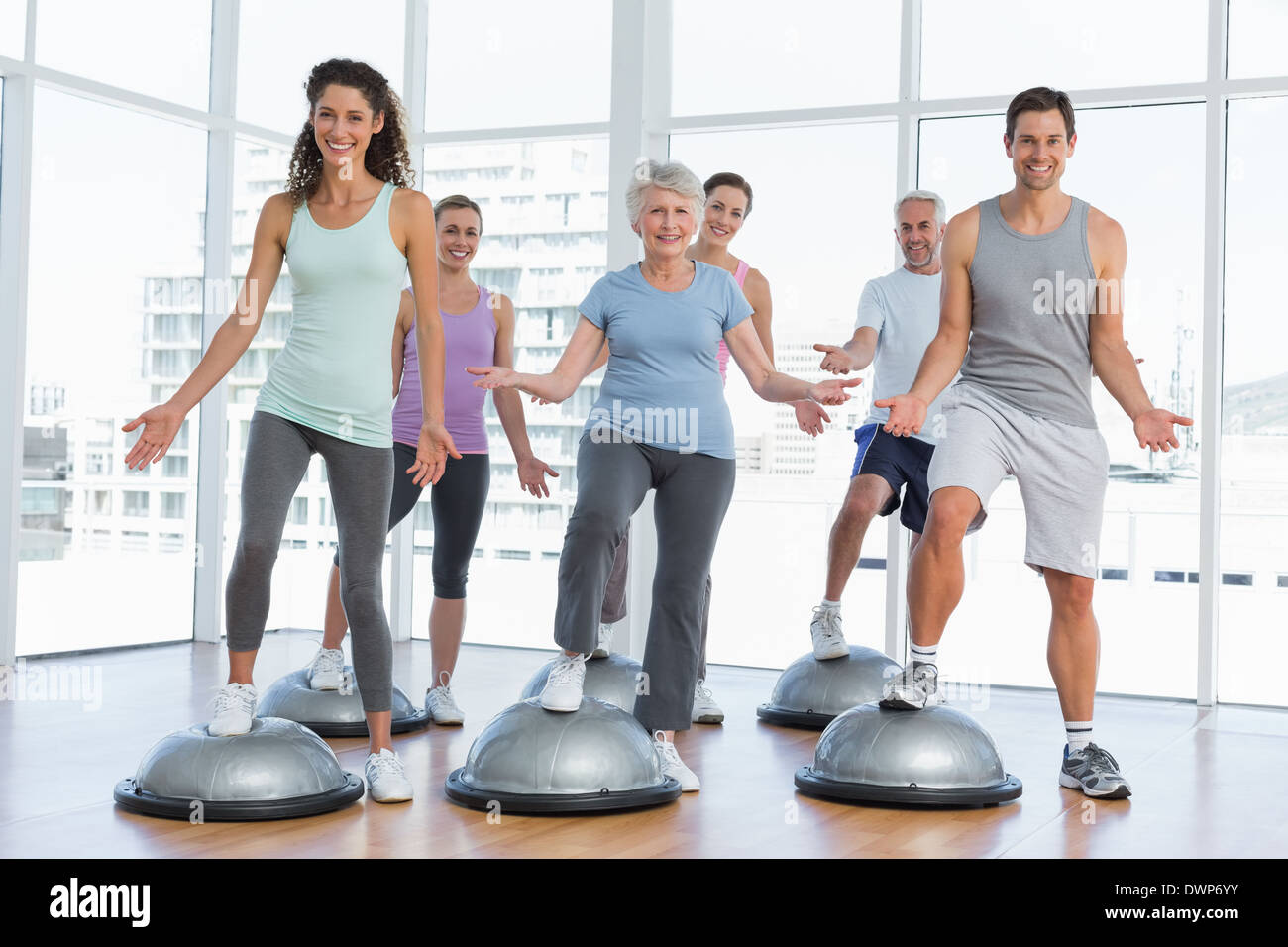 Full length portrait of people doing power fitness exercise Stock Photo ...
