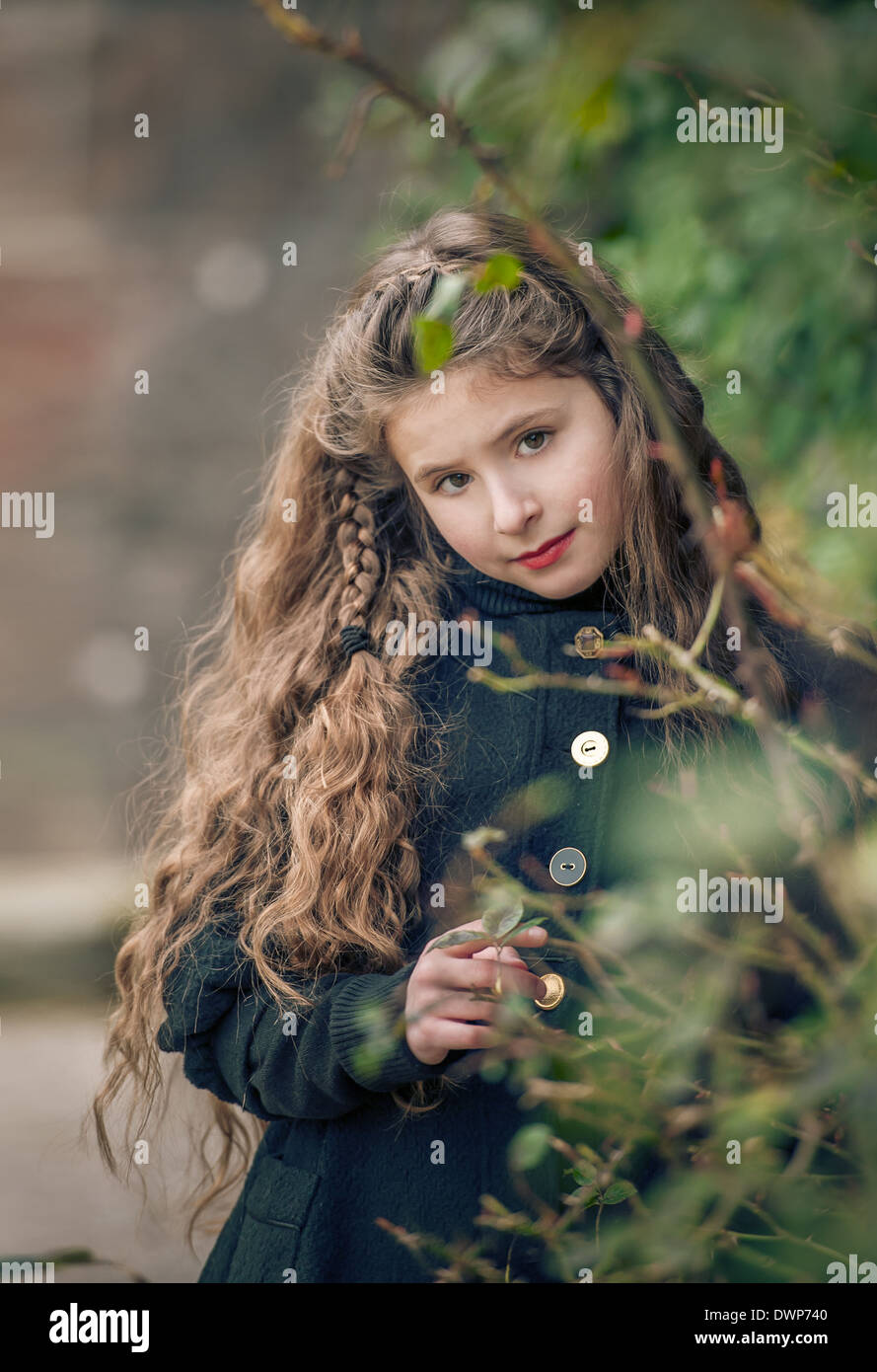 Victorian girl with daffodils in spring Stock Photo - Alamy