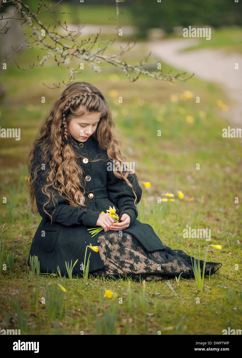 Victorian girl with daffodils in spring Stock Photo - Alamy