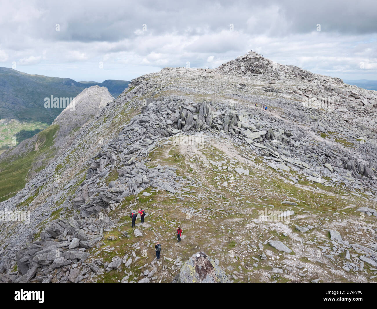 Hill walkers near the summit rock pile of Glyder Fach, in Snowdonia's Y ...