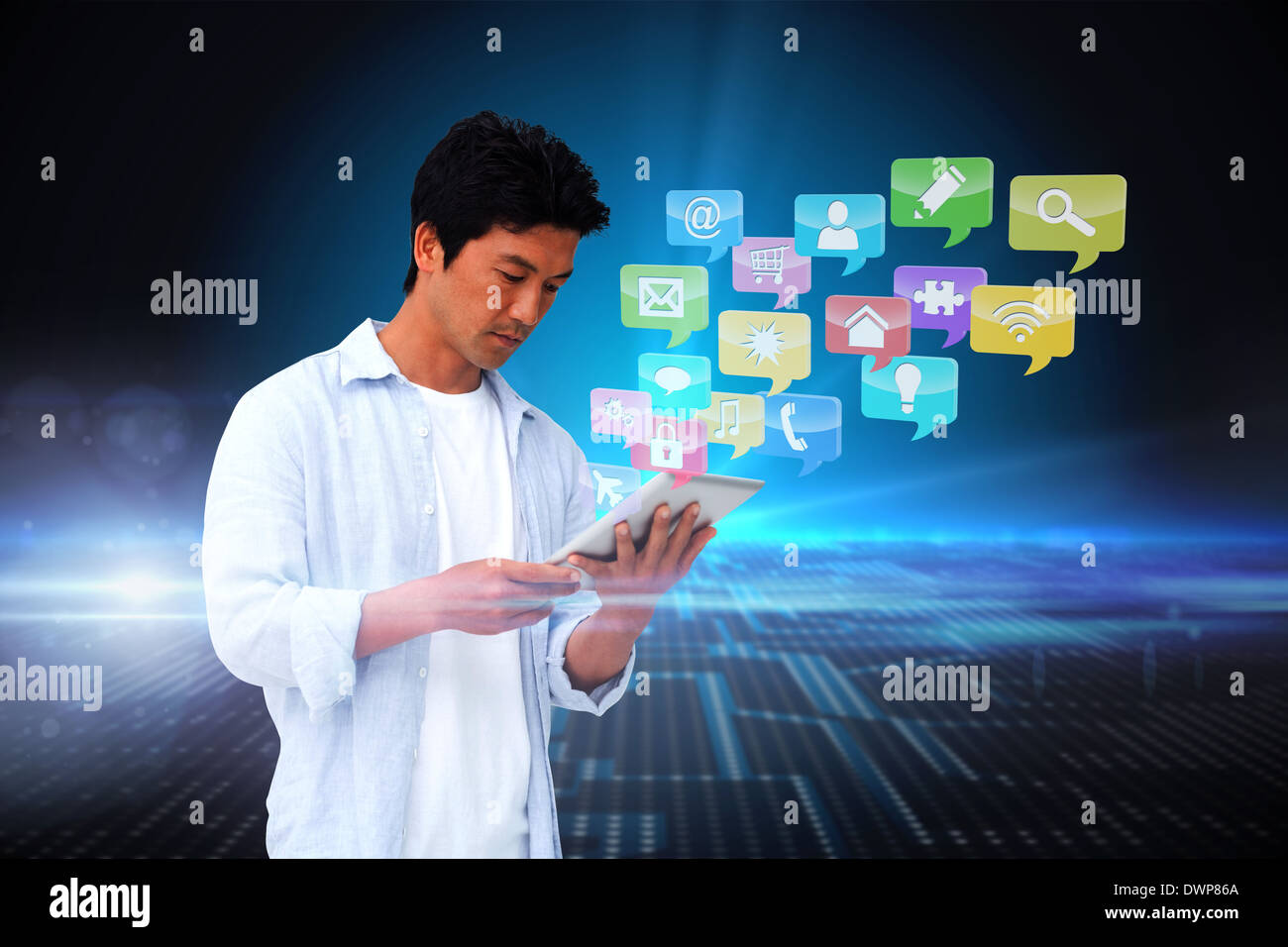 Casual man using tablet with app icons Stock Photo - Alamy