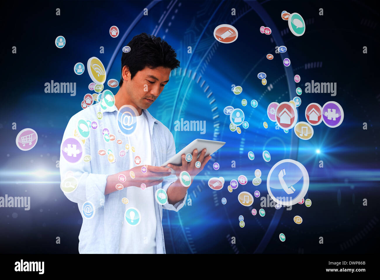 Casual man using tablet with app icons Stock Photo - Alamy
