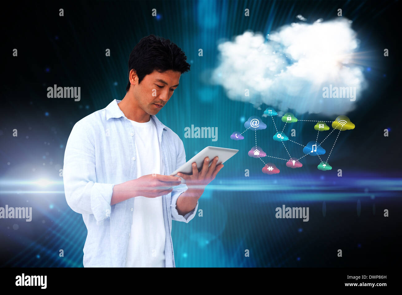 Casual man using tablet with app icons and cloud Stock Photo - Alamy