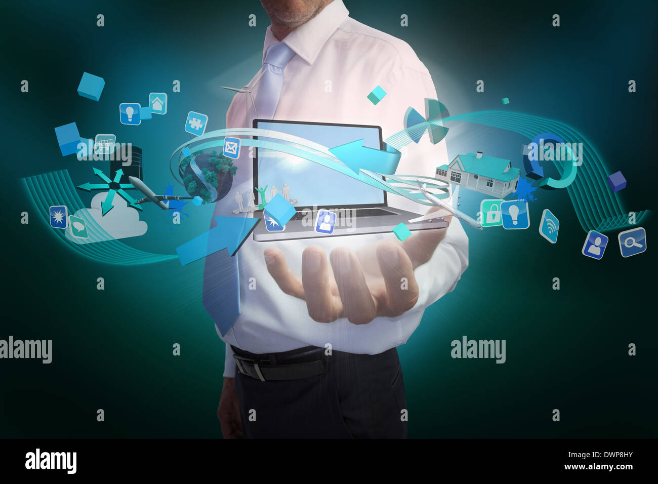 Businessman presenting app icons and laptop Stock Photo - Alamy