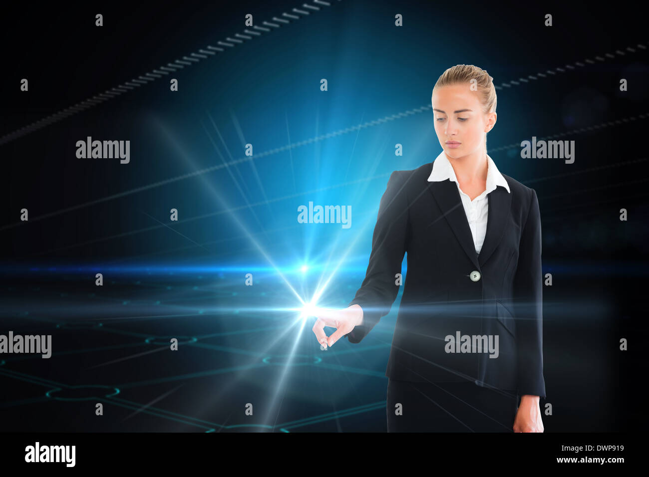 Blonde businesswoman touching light Stock Photo - Alamy