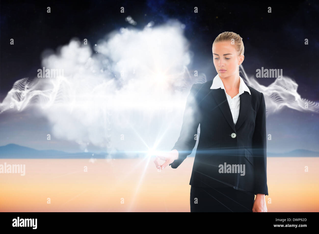 Blonde businesswoman touching light Stock Photo - Alamy