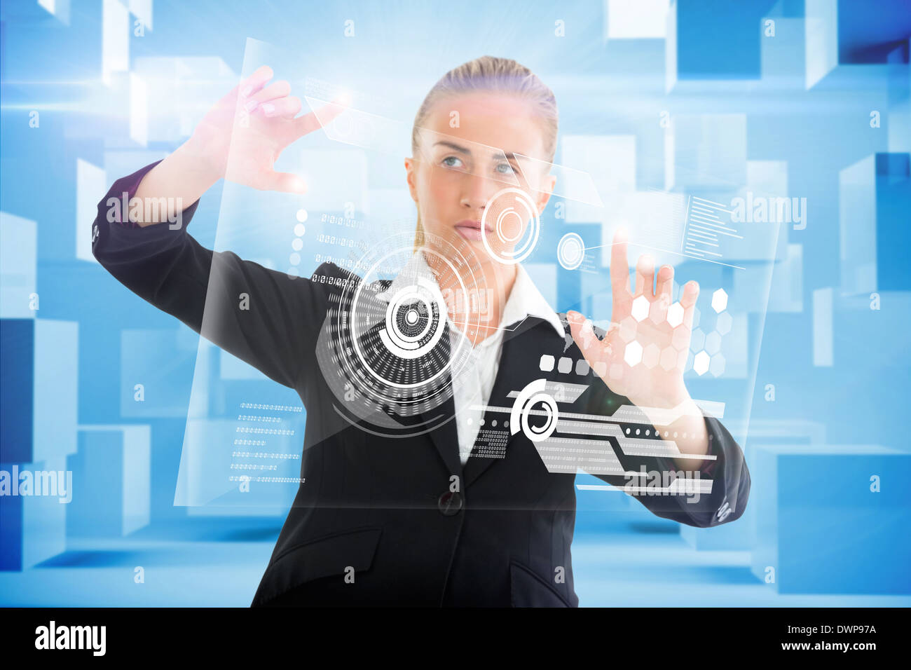 Blonde businesswoman touching interface Stock Photo - Alamy