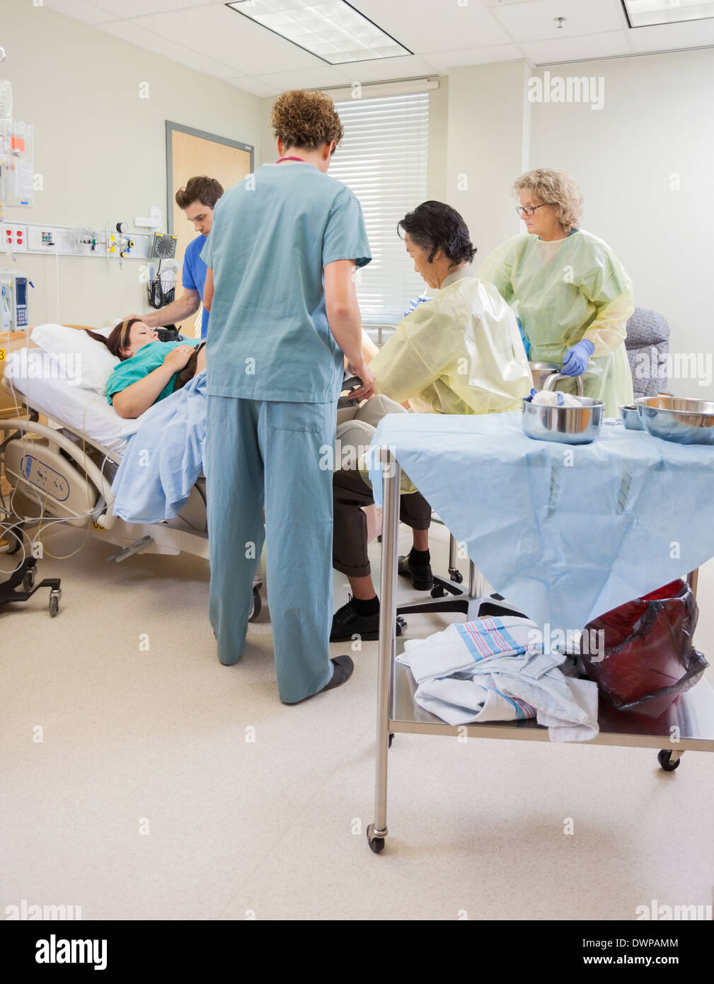 Medical Team Delivering Baby in Hospital Stock Photo - Alamy