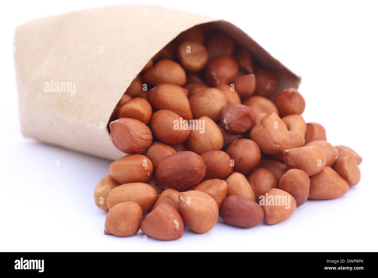 Peanut with a paper pack over white background Stock Photo - Alamy