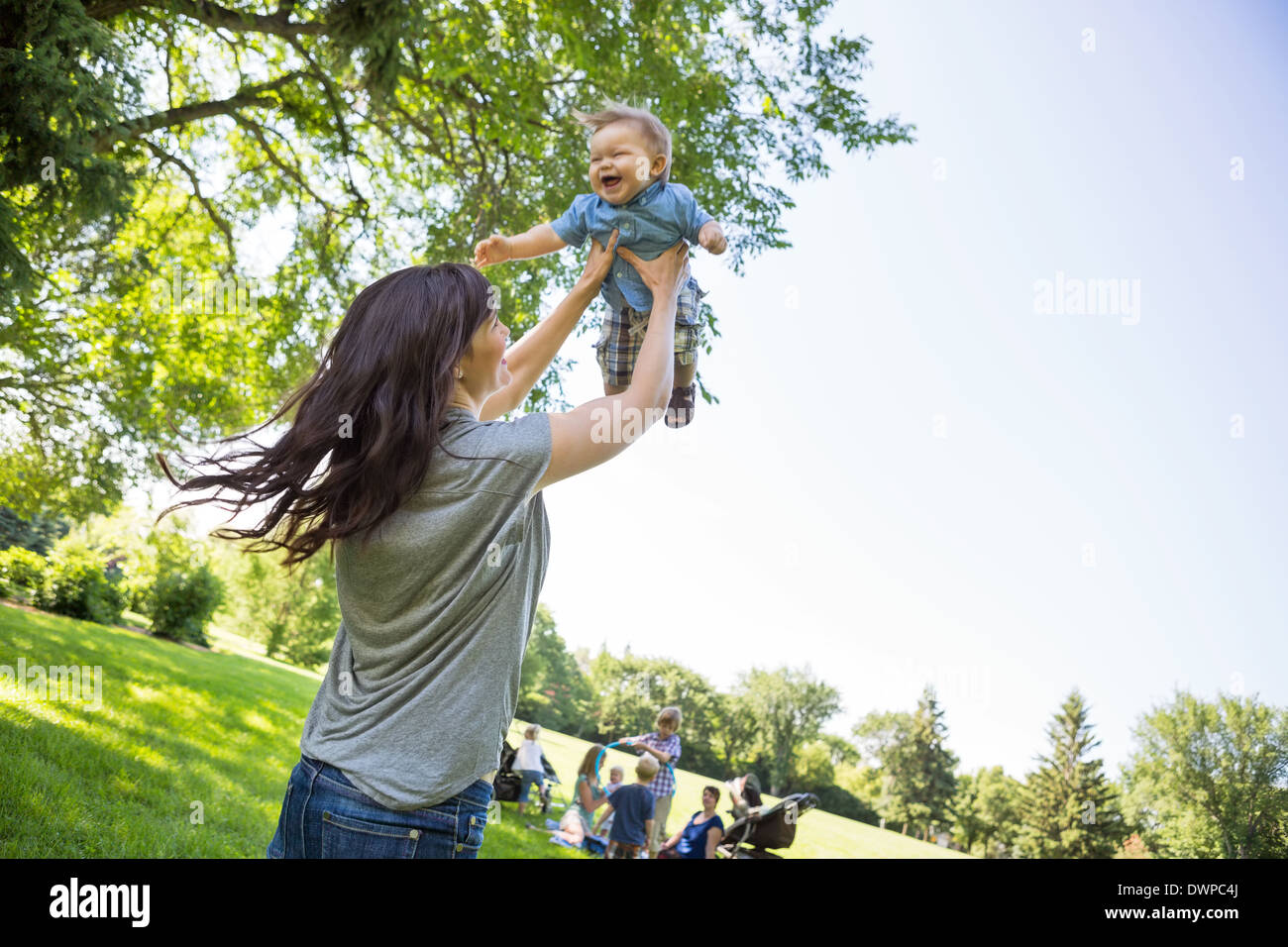 Mom lifting baby hi-res stock photography and images - Alamy
