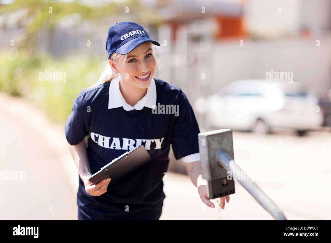 beautiful young volunteer raising money for charity Stock Photo - Alamy
