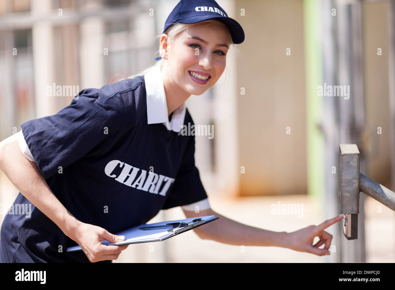 friendly female volunteer raising money for charity Stock Photo - Alamy