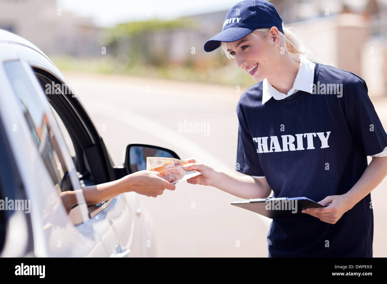 Happy woman receiving money hi-res stock photography and images - Alamy