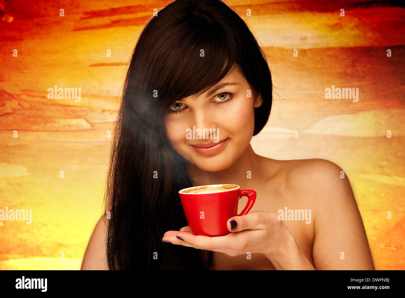Attractive young woman drinking a cup of coffee in early morning Stock ...