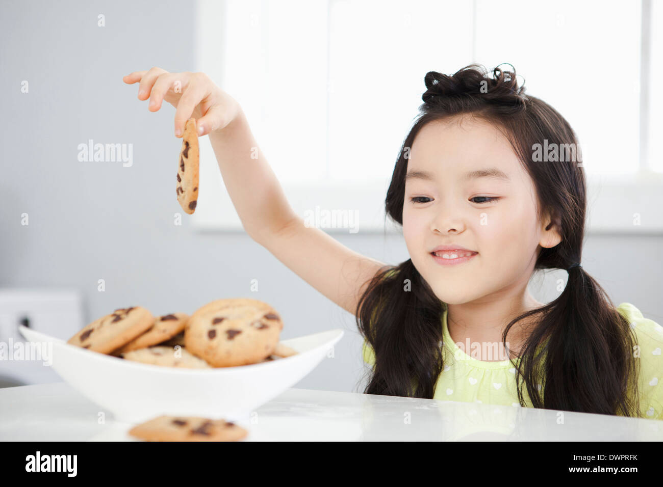 a kid peeking cookies in the kitchen Stock Photo - Alamy