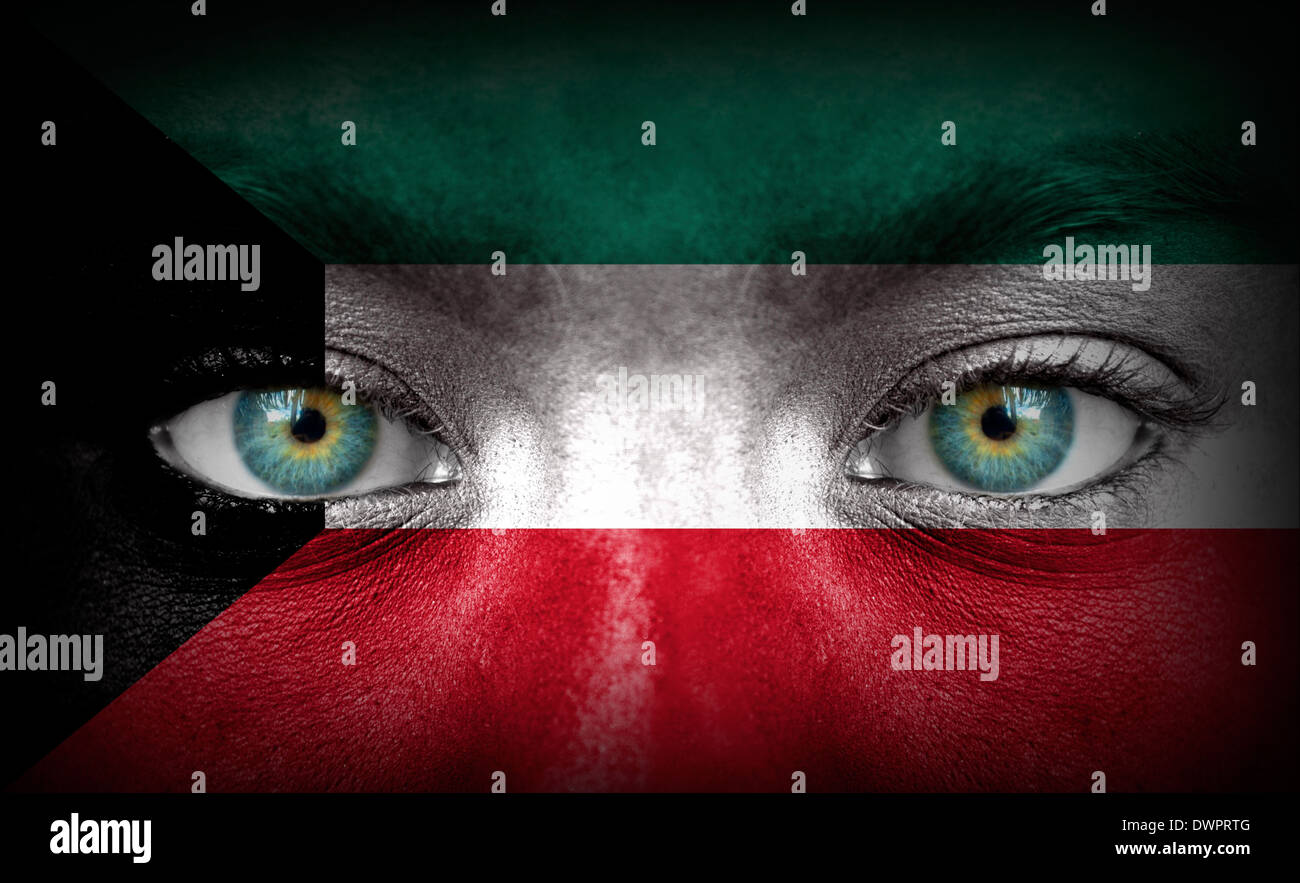 Human face painted with flag of Kuwait Stock Photo - Alamy