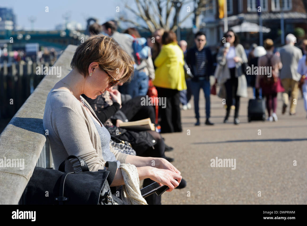 Woman leaning against railings hi-res stock photography and images - Alamy