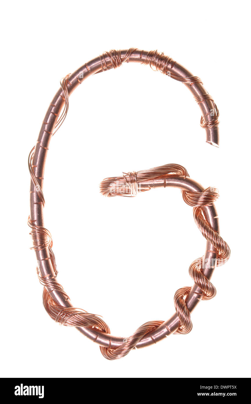 Twisted copper wire in the shape of the letter G Stock Photo - Alamy