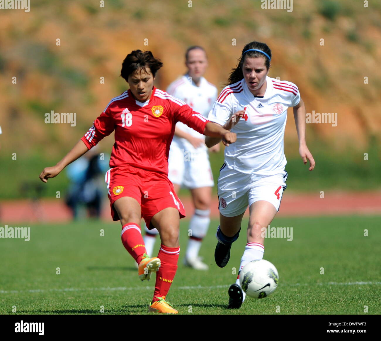 Albufeira. 12th Mar, 2014. China's Han Peng (L) competes during the ...