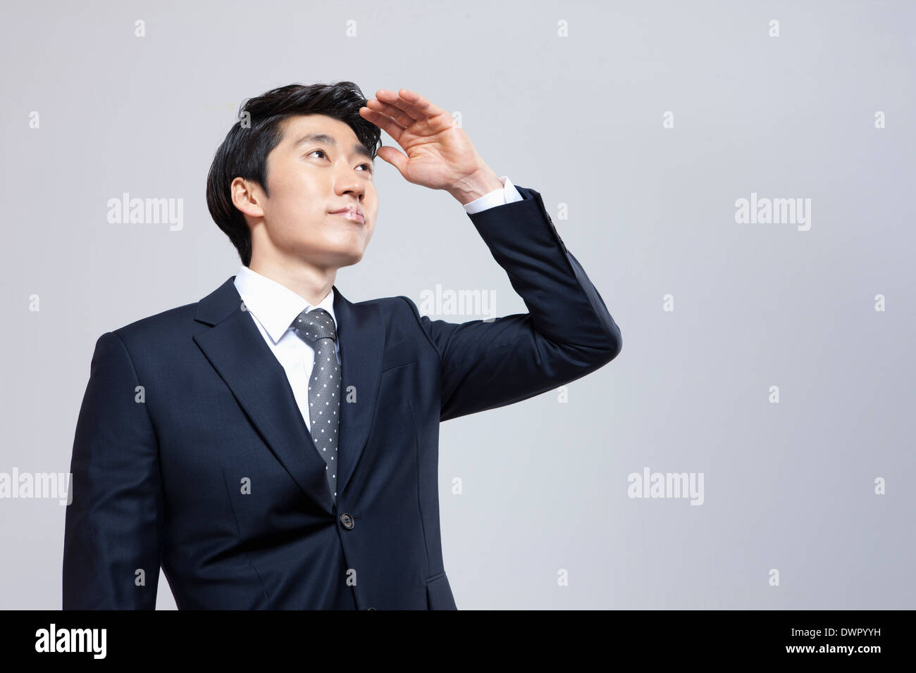 a businessman searching for something Stock Photo - Alamy