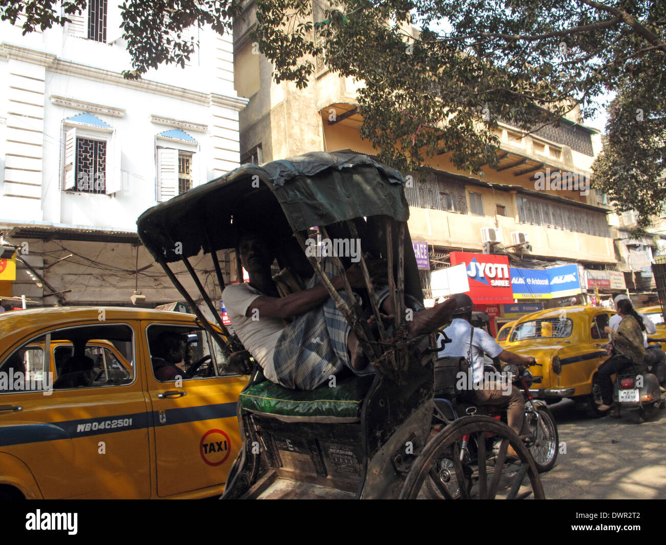 Rickshaw driver wait for passengers on their rickshaw in Kolkata, India ...