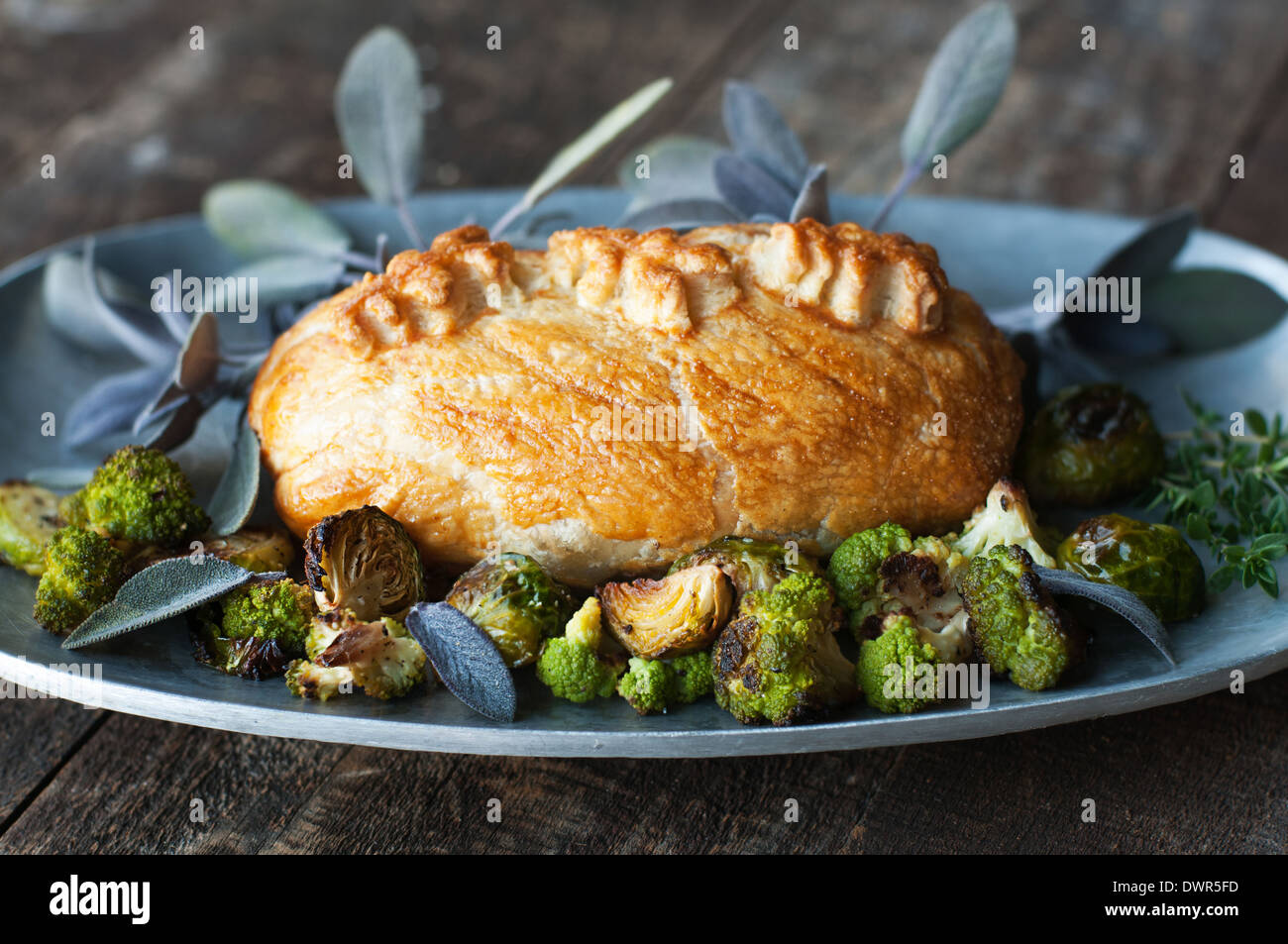 Golden Beef Wellington with purple sage and roasted vegetables Stock ...