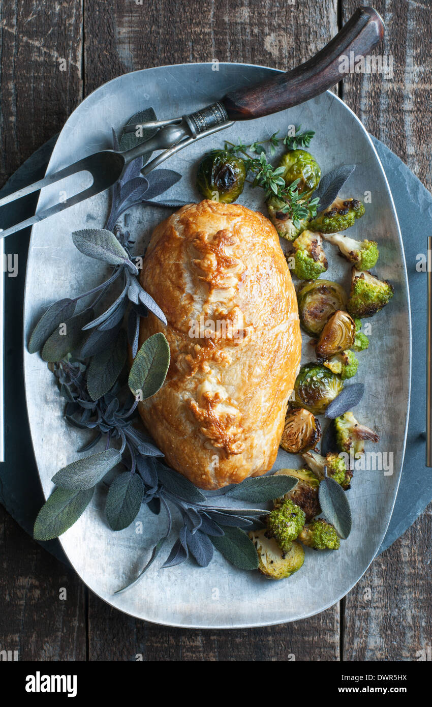 Golden Beef Wellington with purple sage and roasted vegetables Stock ...