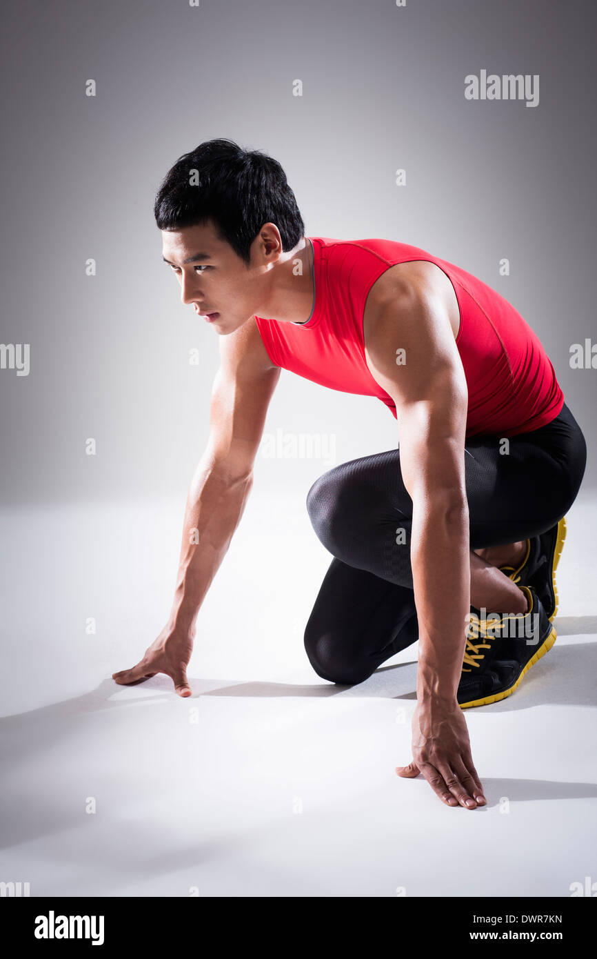 Runner in starting position hi-res stock photography and images - Alamy