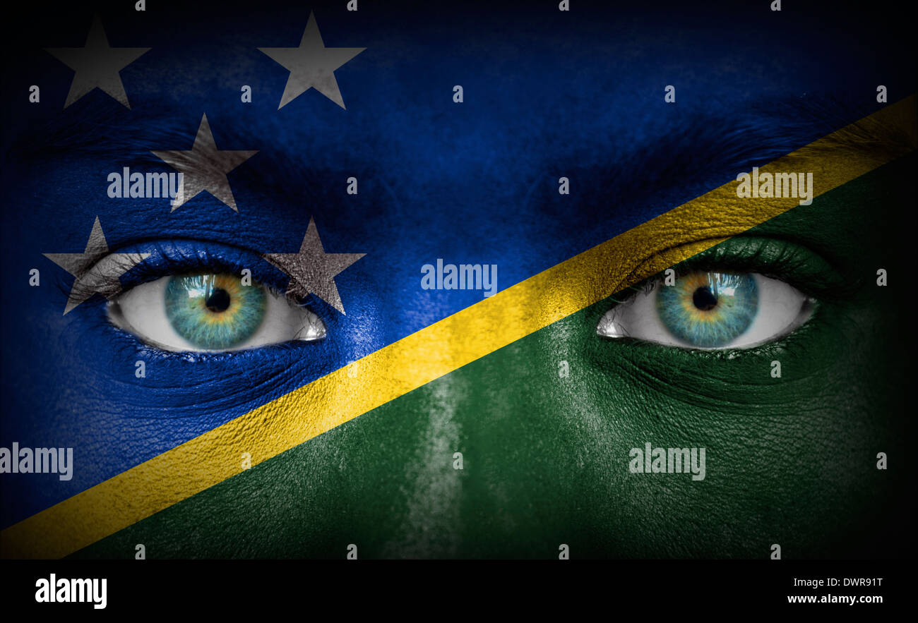 Human face painted with flag of Solomon Islands Stock Photo - Alamy