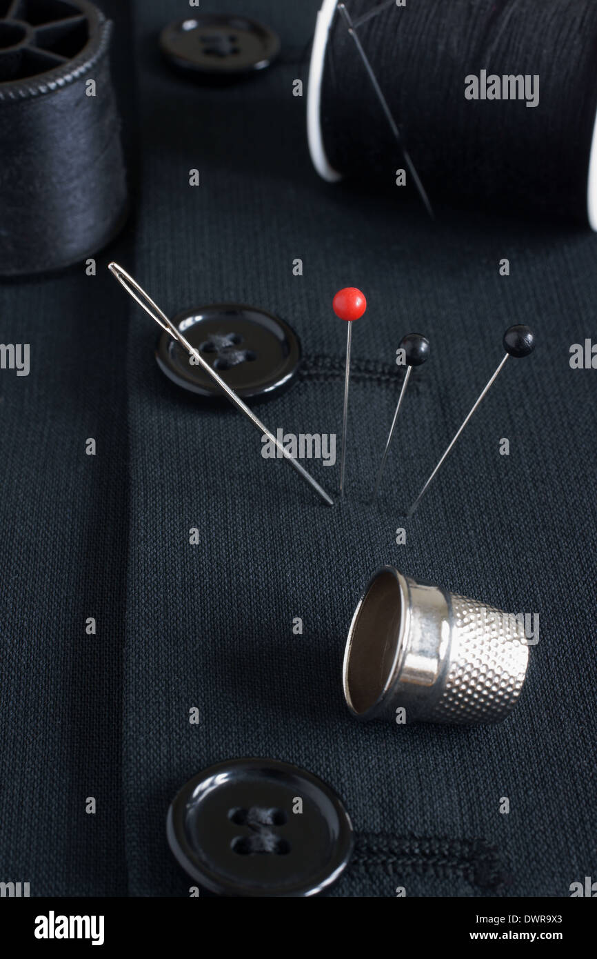 Sewing needle and pins selective focus on pin heads Stock Photo - Alamy