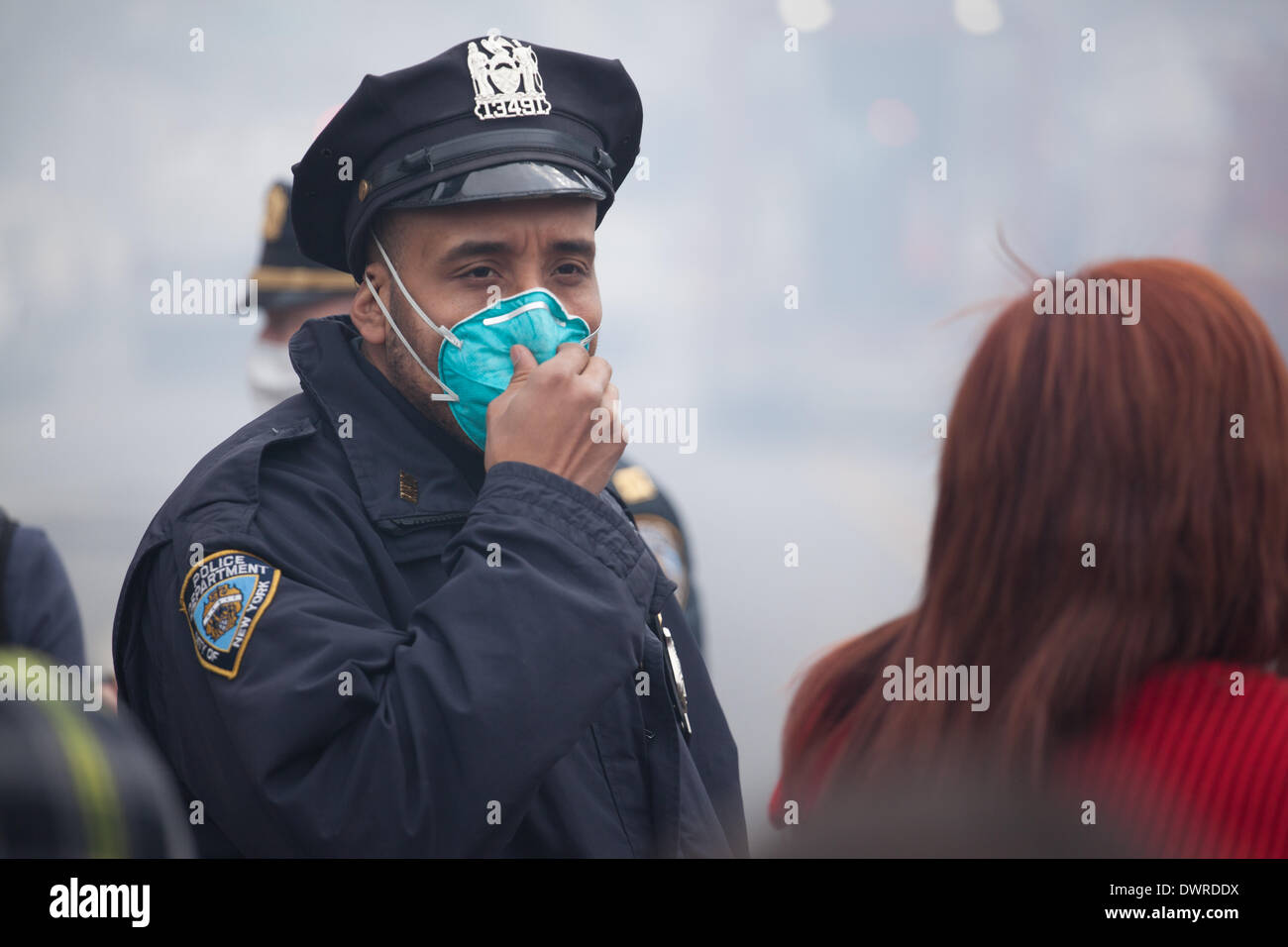 Harlem, New York City. 12 March 2014. A police officer dons an air ...