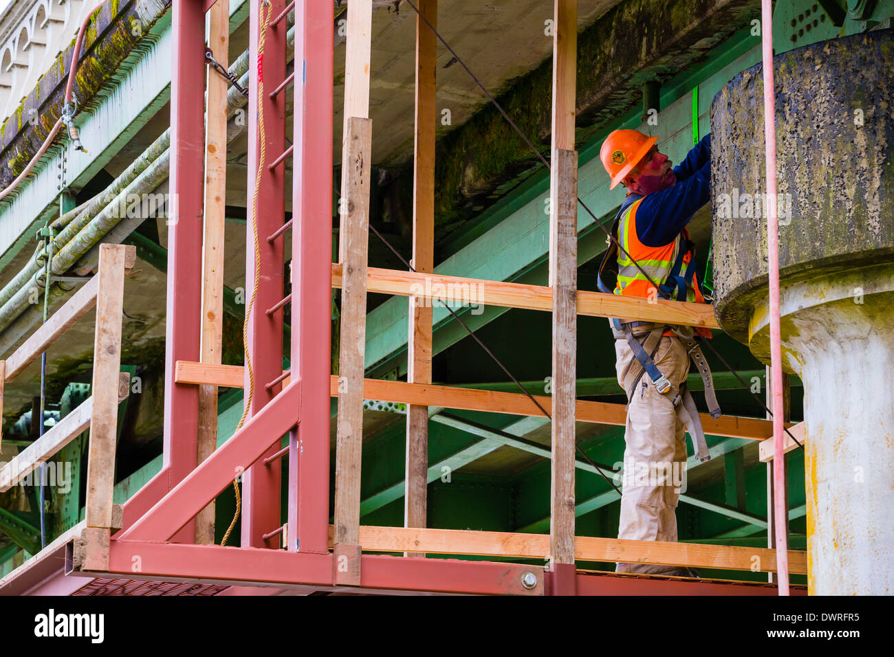 Bridge worker inspecting a bridge for repairs Stock Photo - Alamy
