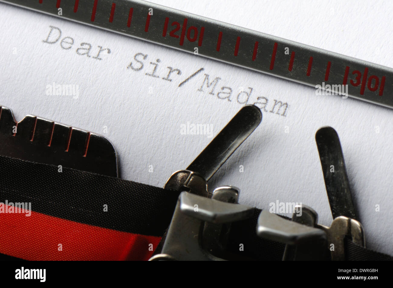 Close-up of old typewriter ribbon and type font on a sheet of paper ...