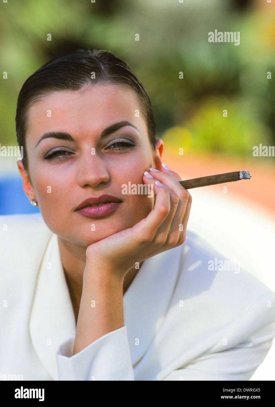 Young power woman with a cigar Stock Photo - Alamy