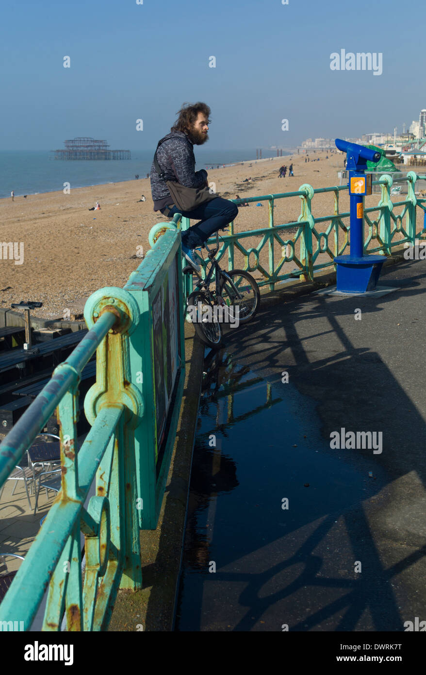 Soaking up the spring sunshine on the Beach at Brighton, with the West ...