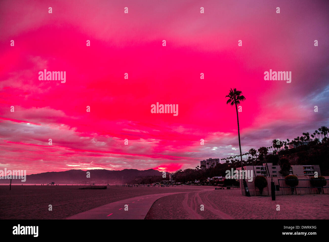A spectacular red sunset at the beach in Santa Monica California ...