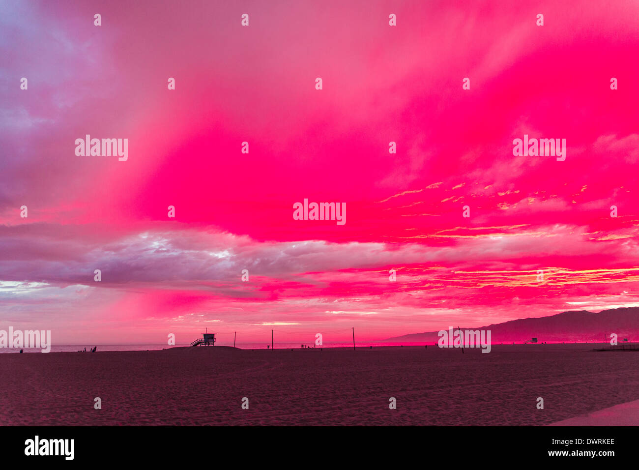 A spectacular red sunset at the beach in Santa Monica California ...