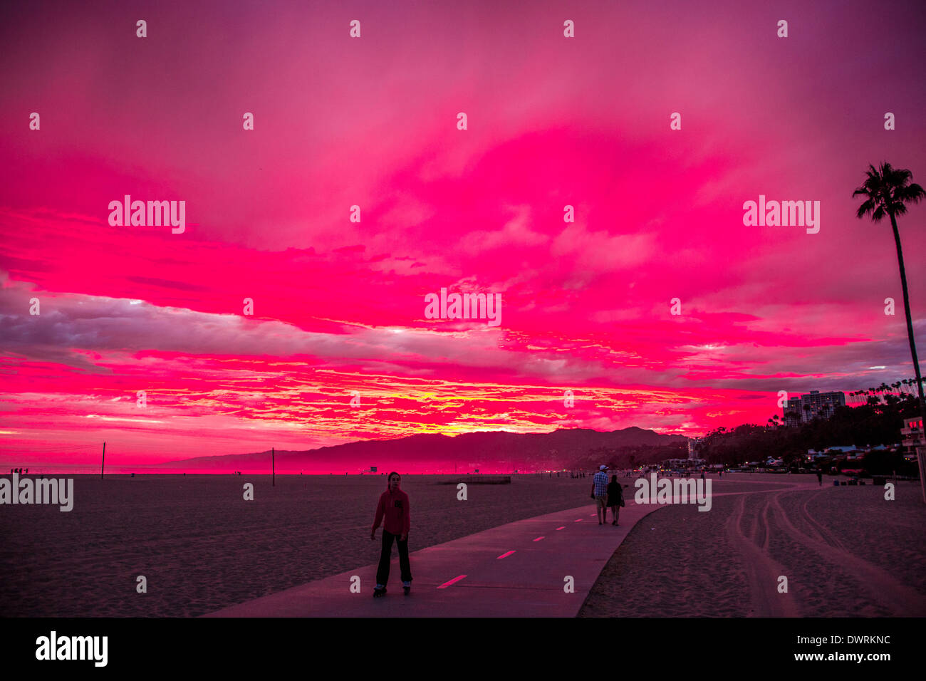 A spectacular red sunset at the beach in Santa Monica California ...