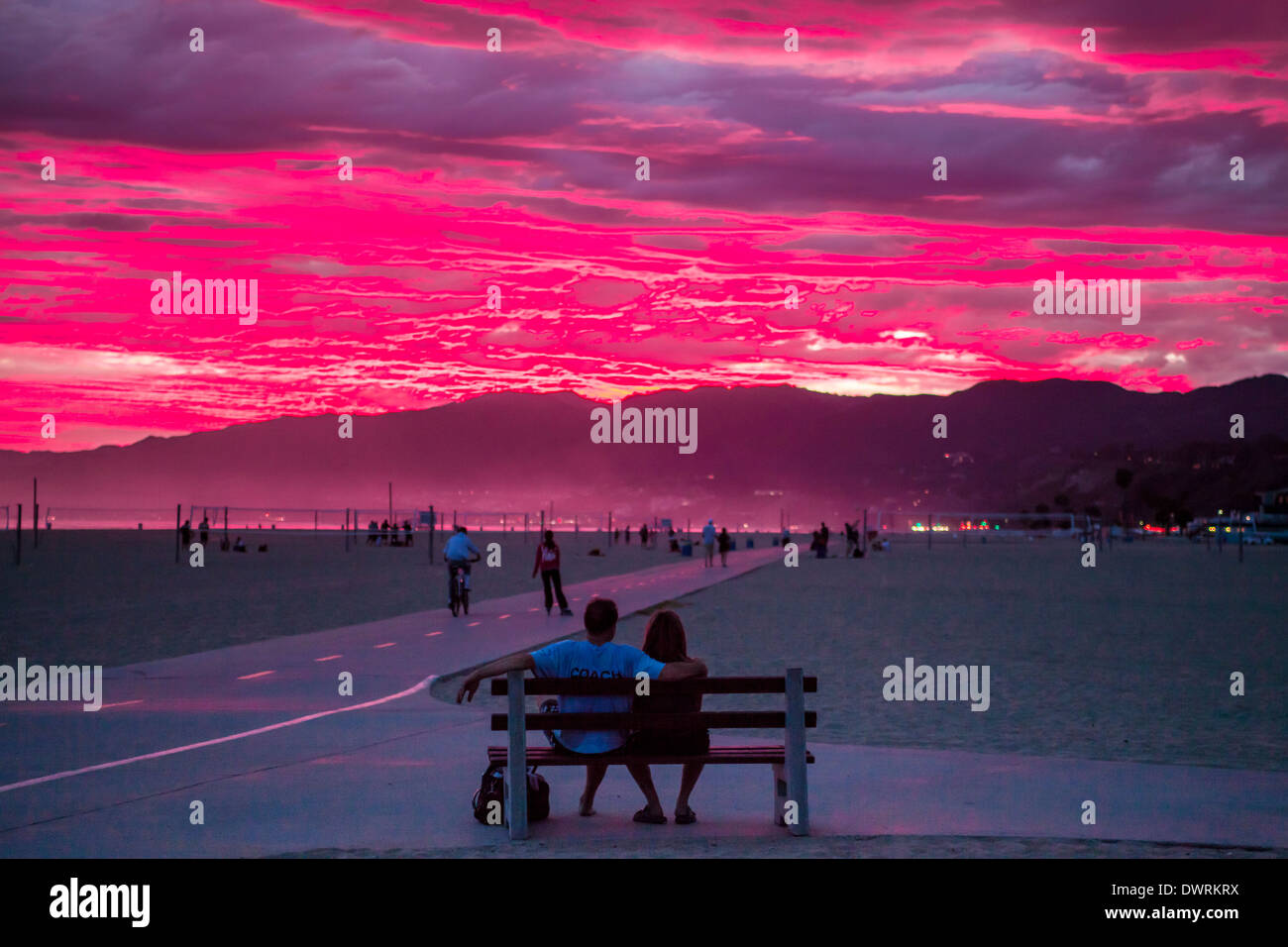 A spectacular red sunset at the beach in Santa Monica California ...