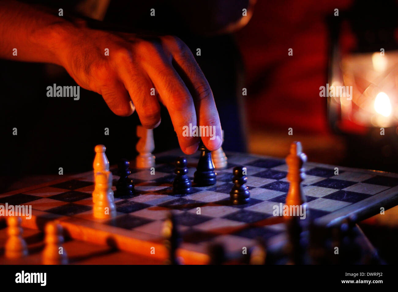 Playing chess by night with friends in Mozambique Stock Photo - Alamy