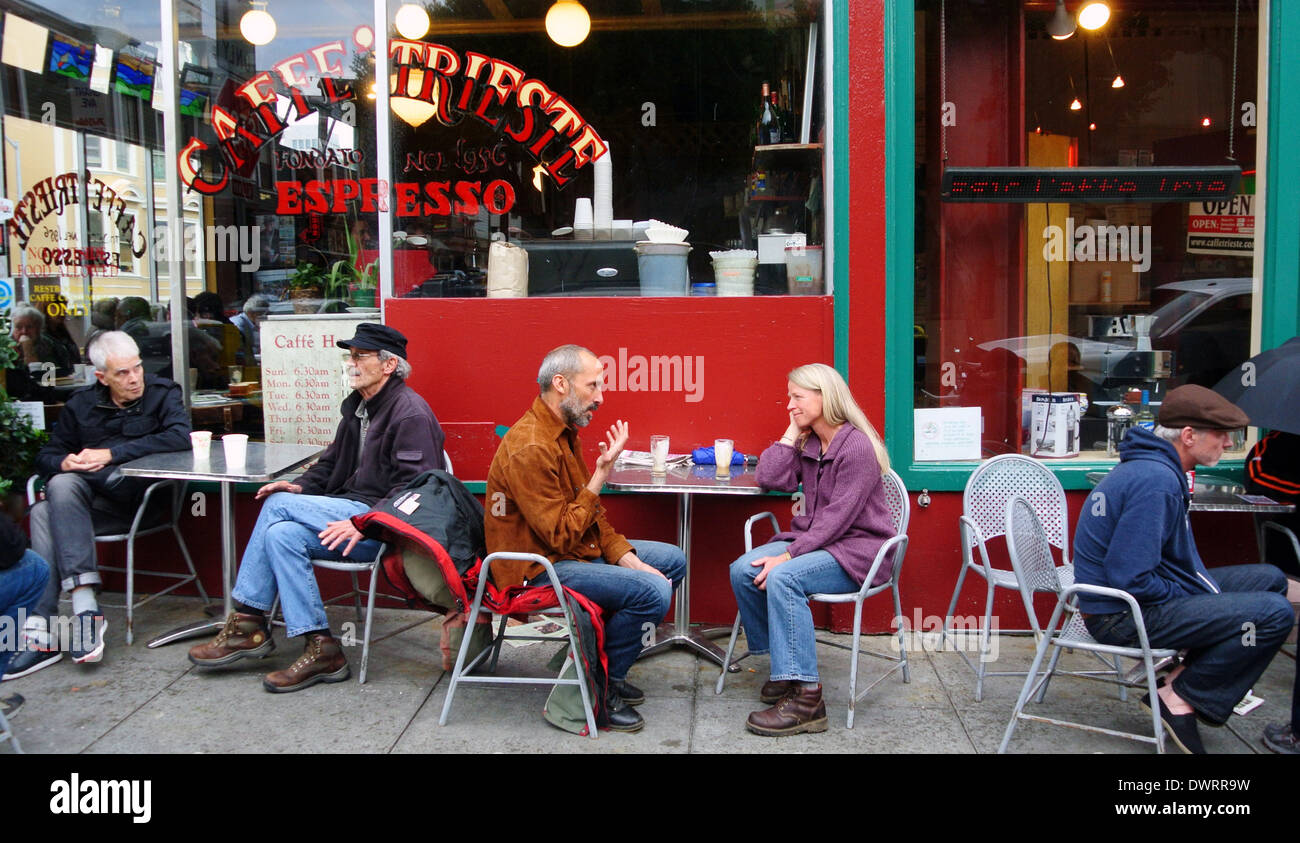 North Beach residents sit outside cafe trieste in front of Cafe Stock ...