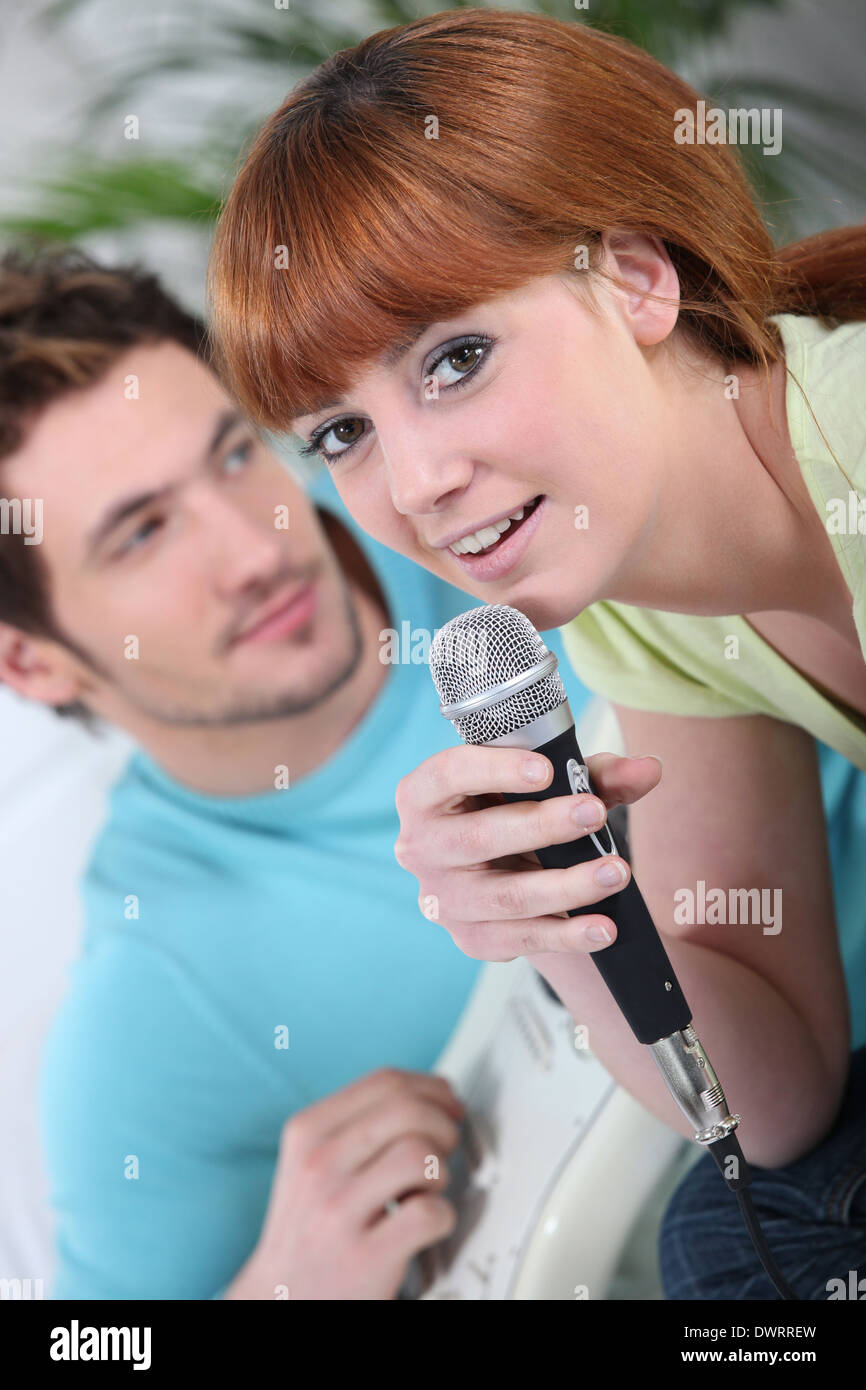 Couple singing karaoke Stock Photo - Alamy