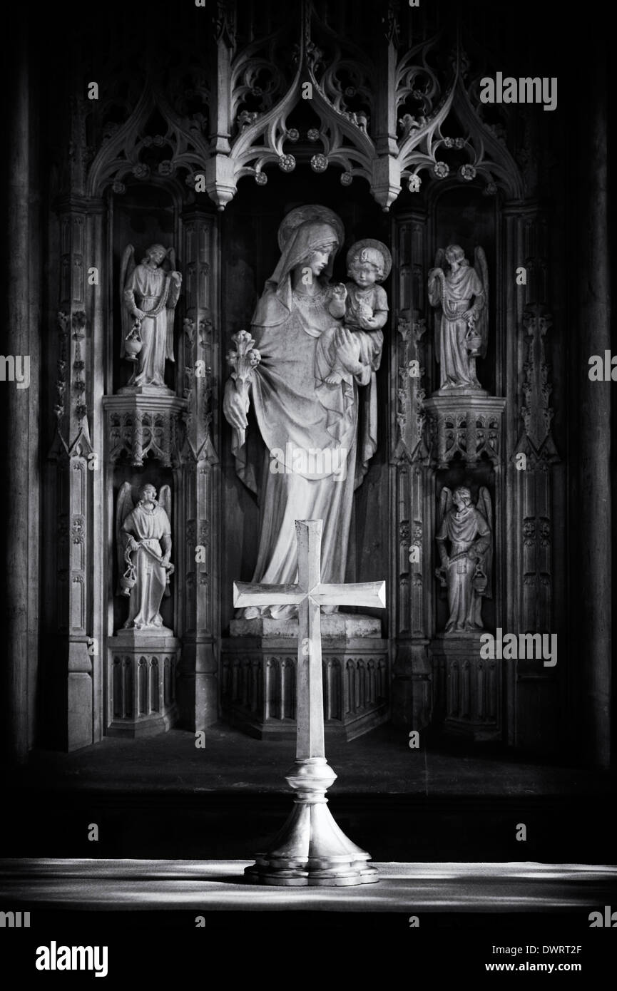 Silver altar cross in front of Mary and Jesus in St John The Baptist ...