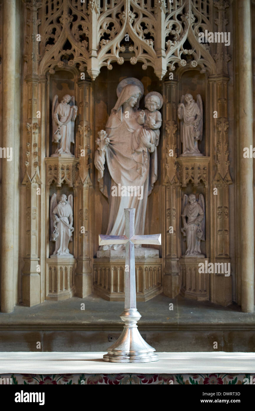 Silver altar cross in front of Mary and Jesus in St John The Baptist ...